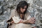 Nephi showing his broken bow to Lehi