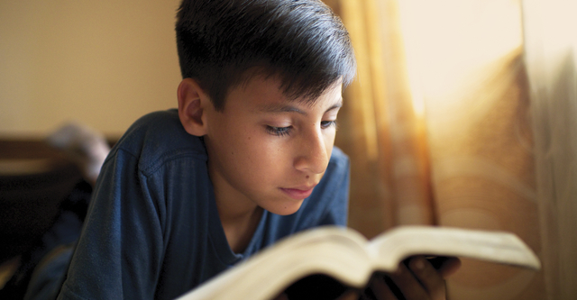 Young Boy Reading the Scriptures