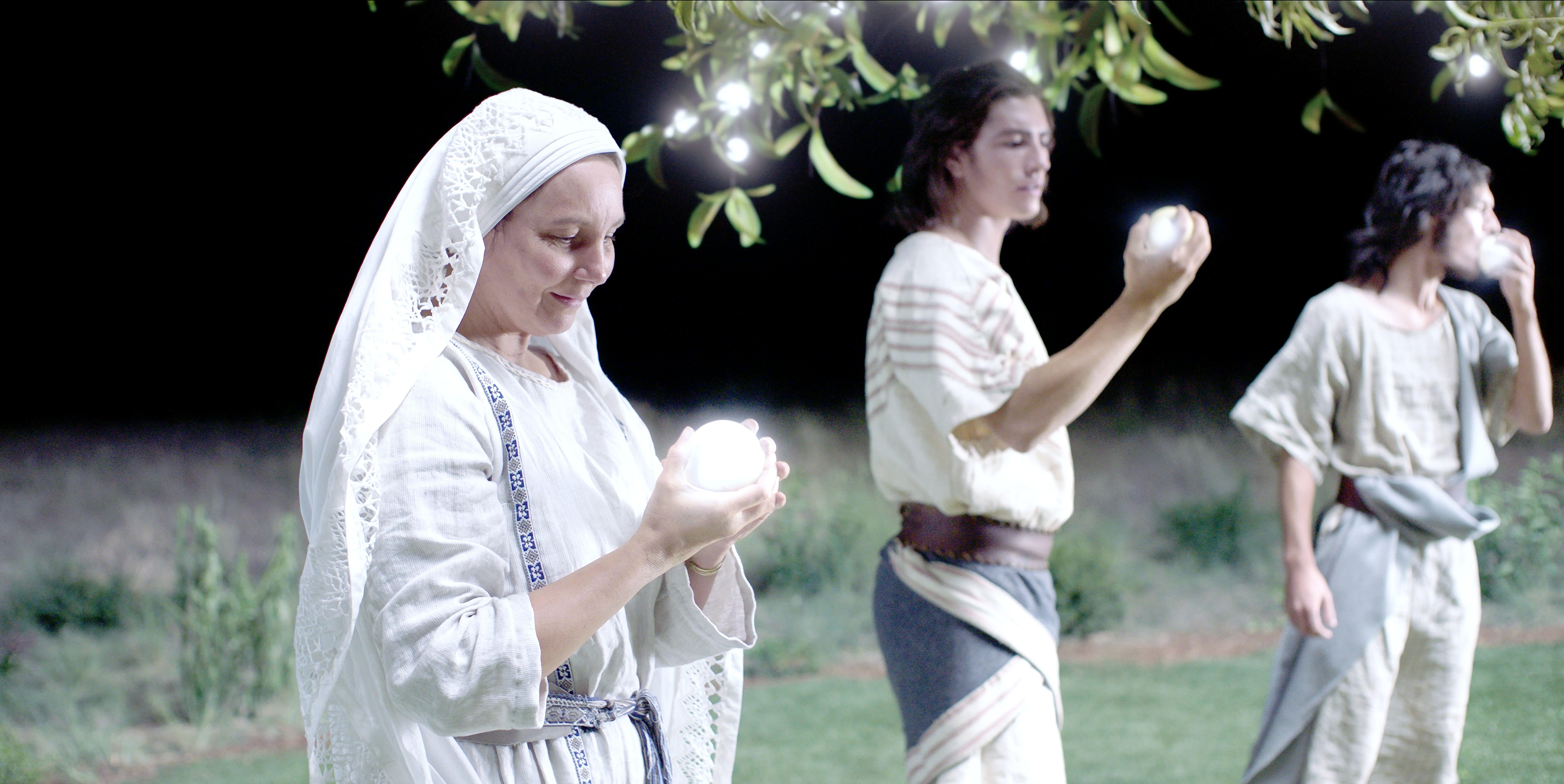 Sariah listening to Lehi speak about his vision of the tree of life