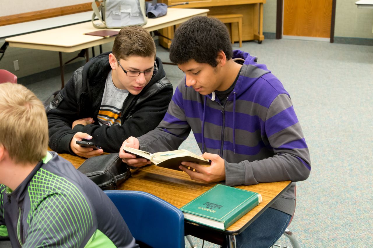 Sister Missionaries Reading the Scriptures